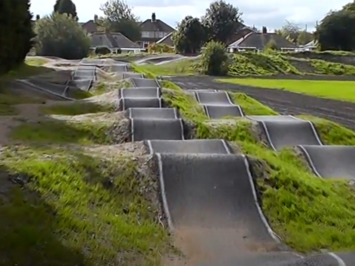 Great, all-weather pumptrack in a nice park, with Adventure playground ...